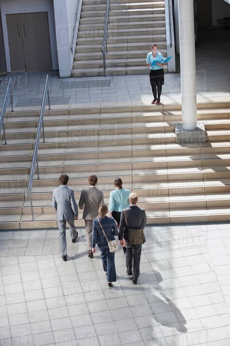 Business people walking on steps - Royalty-free Stock Photo | Dissolve