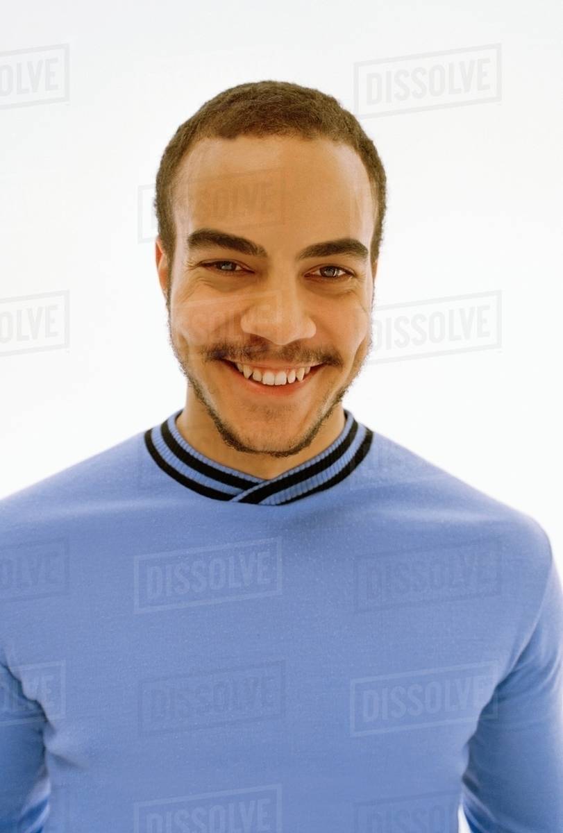 Close up of man's smiling face - Stock Photo - Dissolve