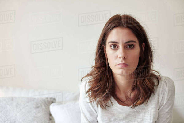 Portrait of young woman staring at camera - Royalty-free Stock Photo ...