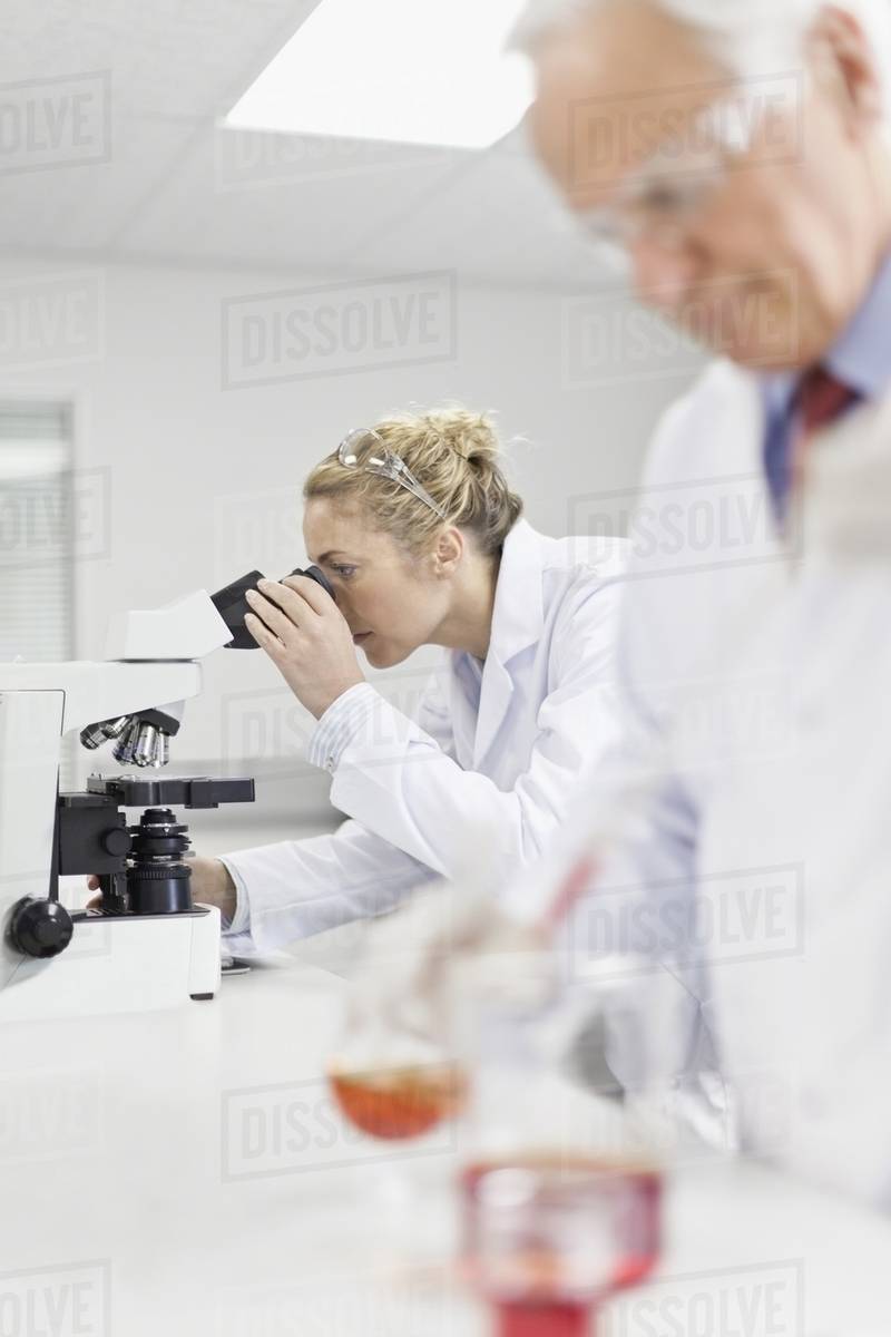 Scientists working in pathology lab - Royalty-free Stock Photo | Dissolve