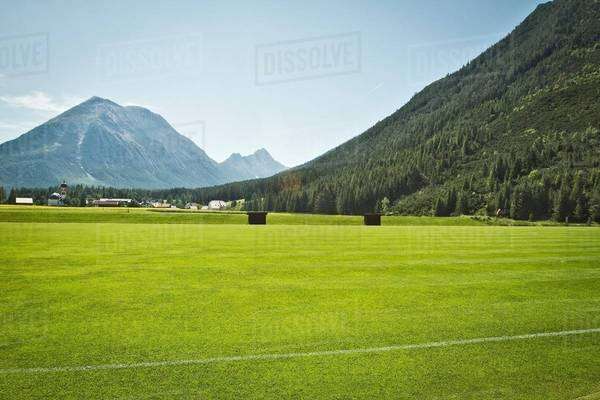 Sports field in rural landscape - Stock Photo - Dissolve