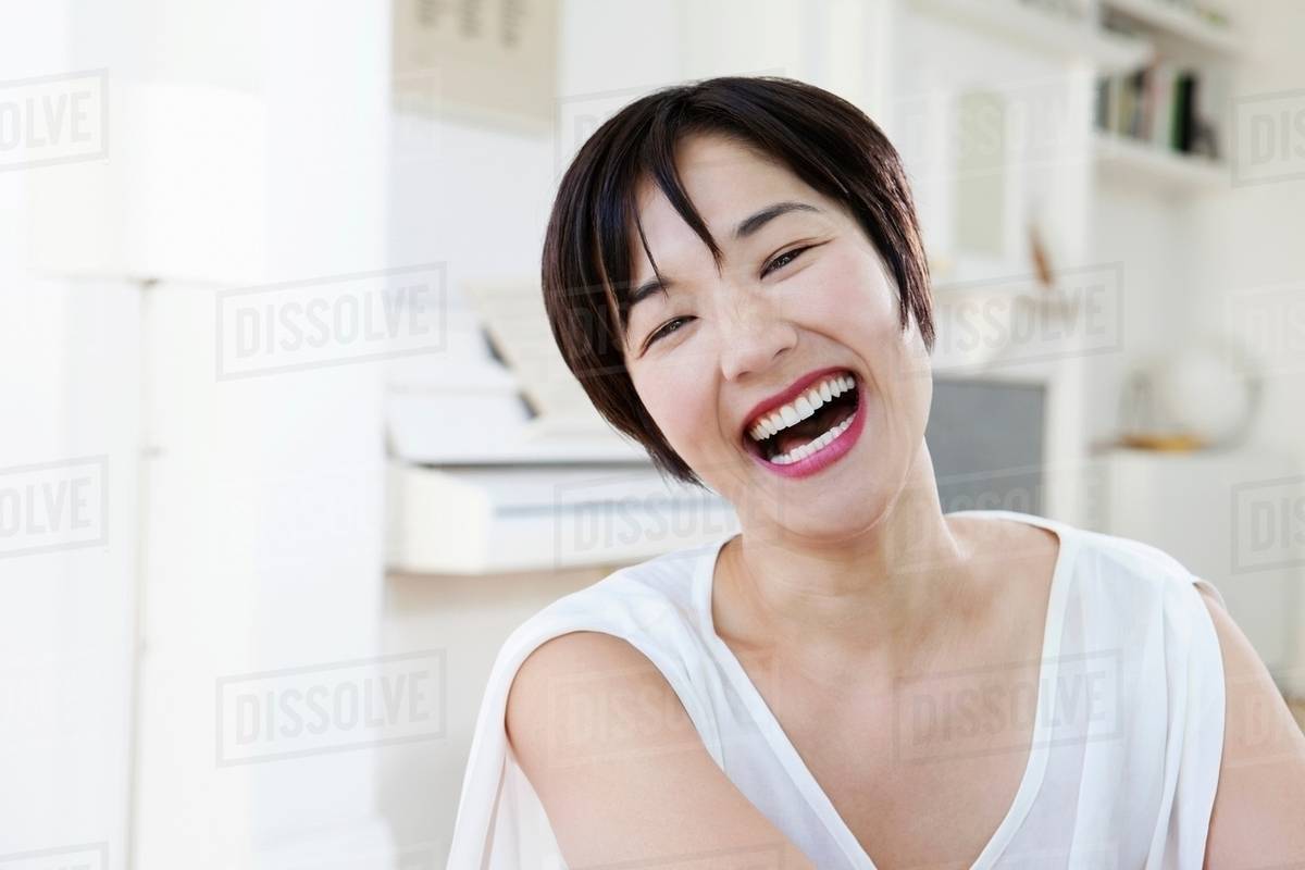 Close up of woman laughing - Royalty-free Stock Photo | Dissolve