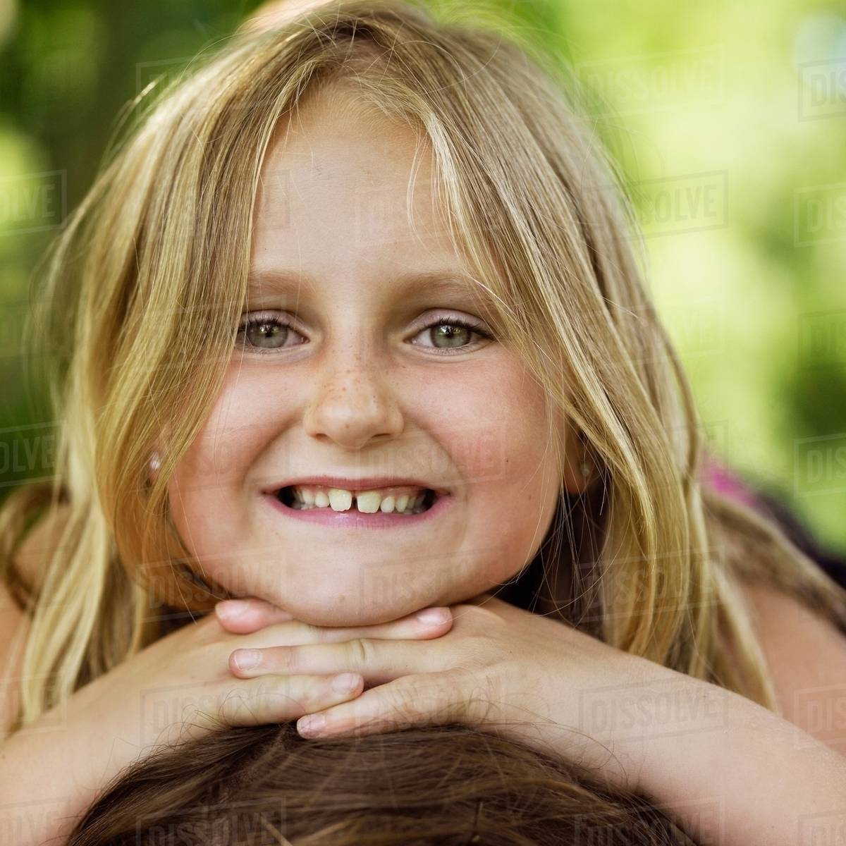 Close up of girl's smiling face - Royalty-free Stock Photo | Dissolve