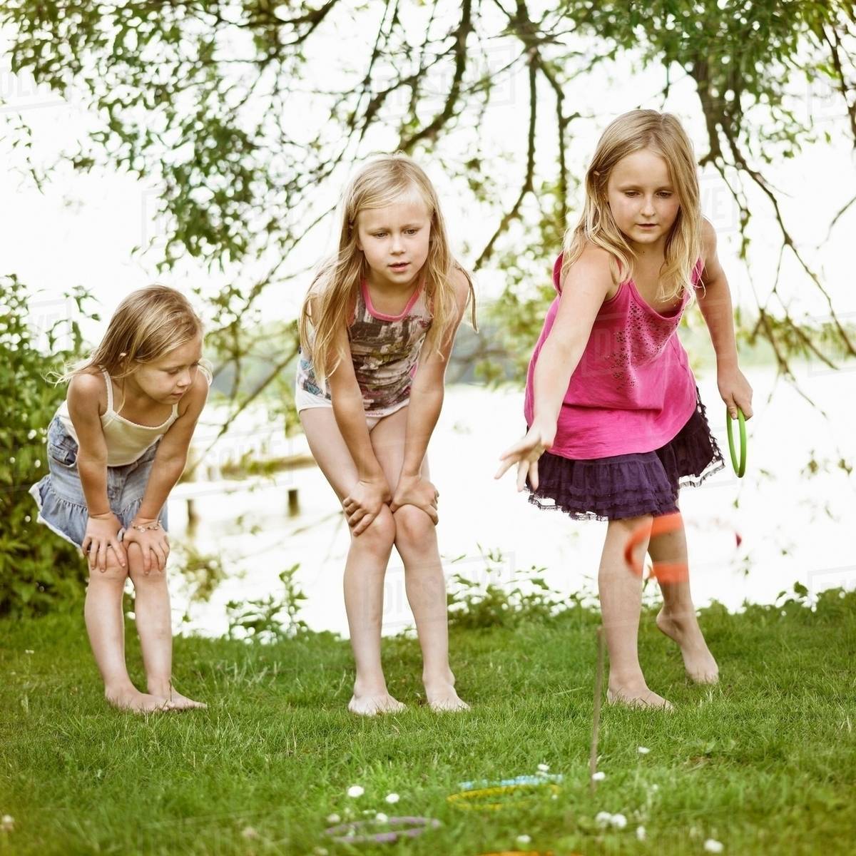 Girls playing with rings together - Stock Photo - Dissolve