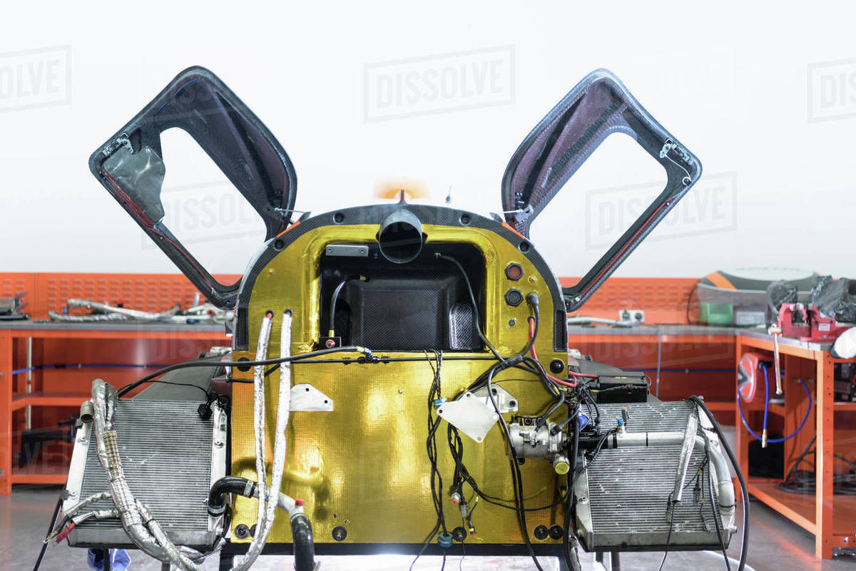 Car under construction in racing car factory - Stock Photo - Dissolve