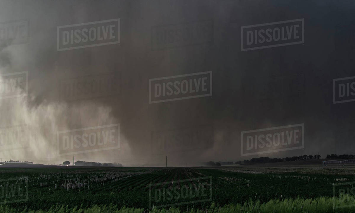 A violent, rain-wrapped wedge tornado rips up farmland in rural Kansas ...