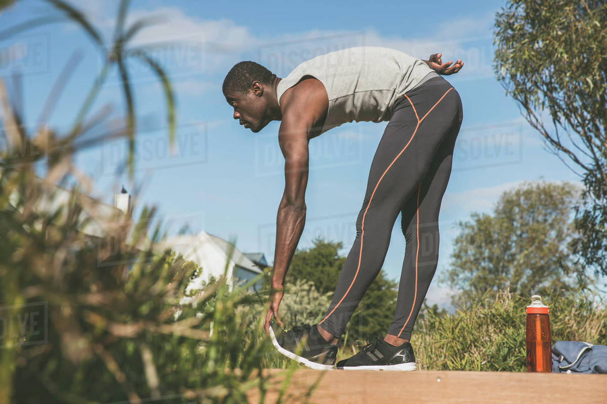 Man bending forwards touching toes, stretching - Royalty-free Stock ...