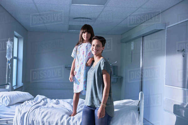 Portrait of girl patient and mother in hospital children's ward ...