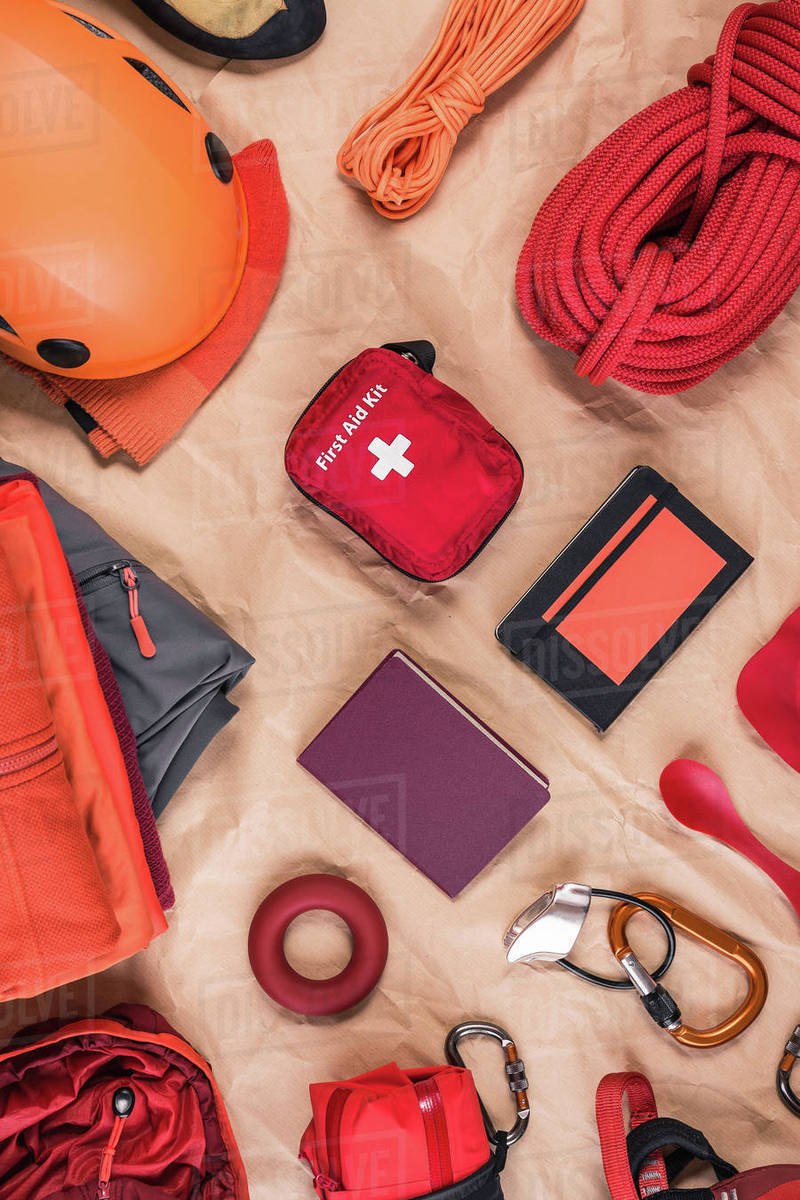 Overhead view of climbing equipment with climbing helmet, first aid kit ...