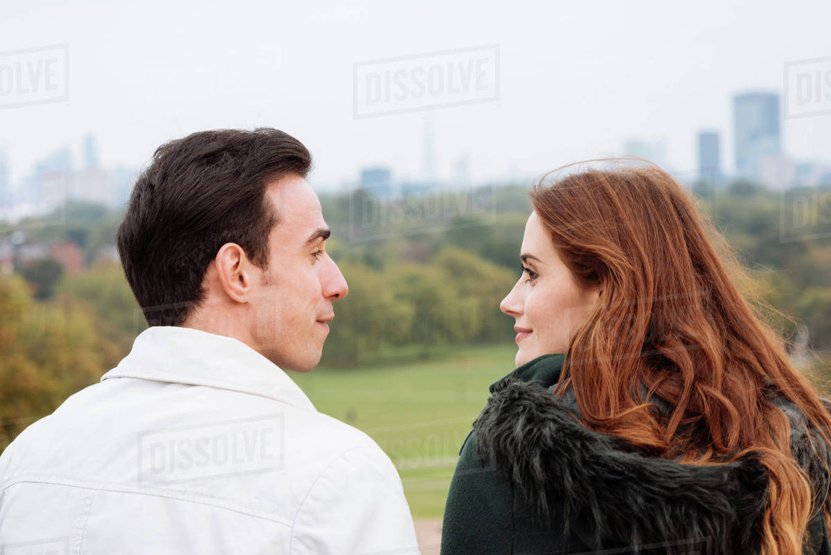 Rear view of couple face to face - Royalty-free Stock Photo | Dissolve