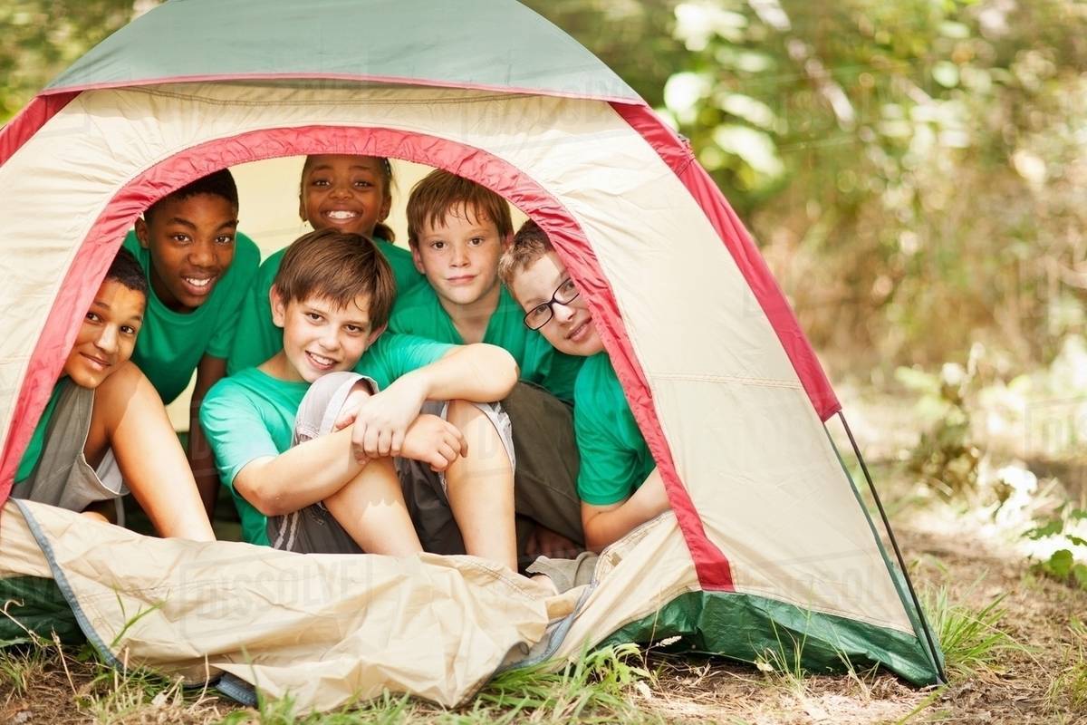 Students sitting in camp tent - Stock Photo - Dissolve
