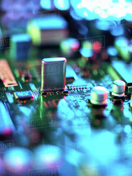 Close up of hi-tech electronic circuit board - Stock Photo - Dissolve