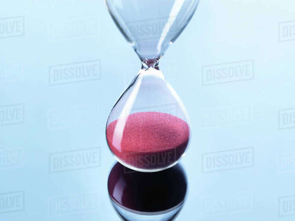 Hourglass running out of time - Royalty-free Stock Photo | Dissolve