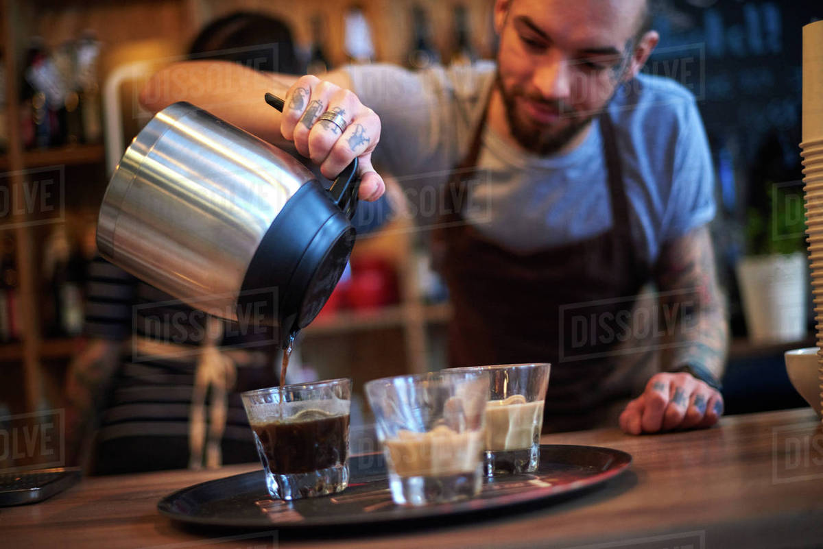 Barista making coffee - Stock Photo - Dissolve