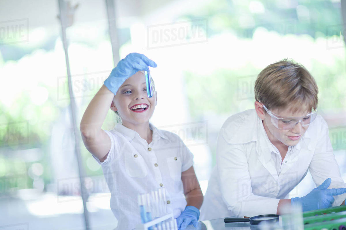 Children playing scientists in lab - Royalty-free Stock Photo | Dissolve