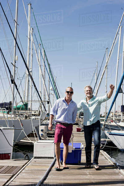 Two men on jetty - Royalty-free Stock Photo | Dissolve