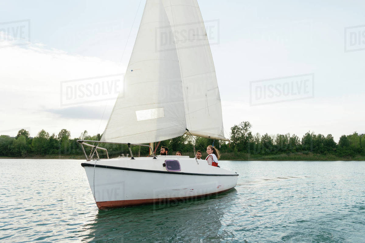 Group of people on sailing boat on lake, Signa, Tuscany, Italy - Stock ...