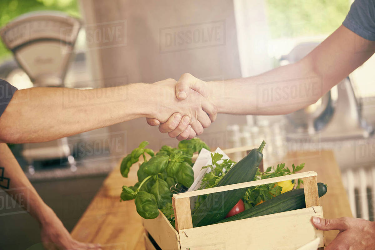 Chef and vegetable delivery man shaking hands - Royalty-free Stock ...