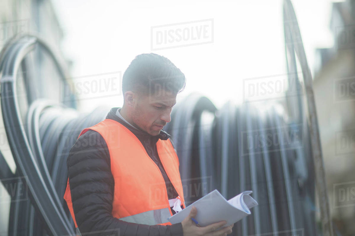 Road engineer standing by cables - Stock Photo - Dissolve