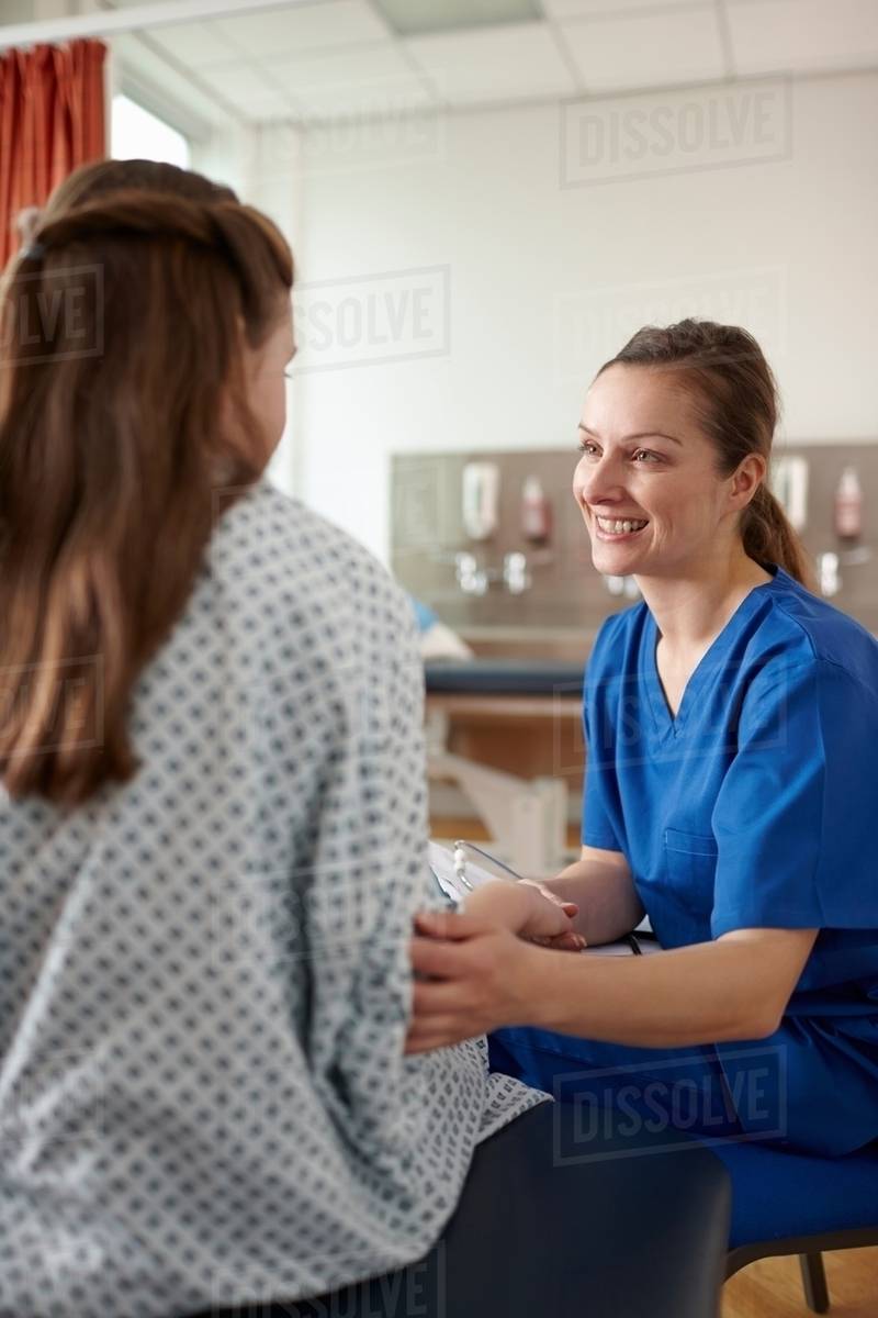 Nurse talking to patient - Stock Photo - Dissolve