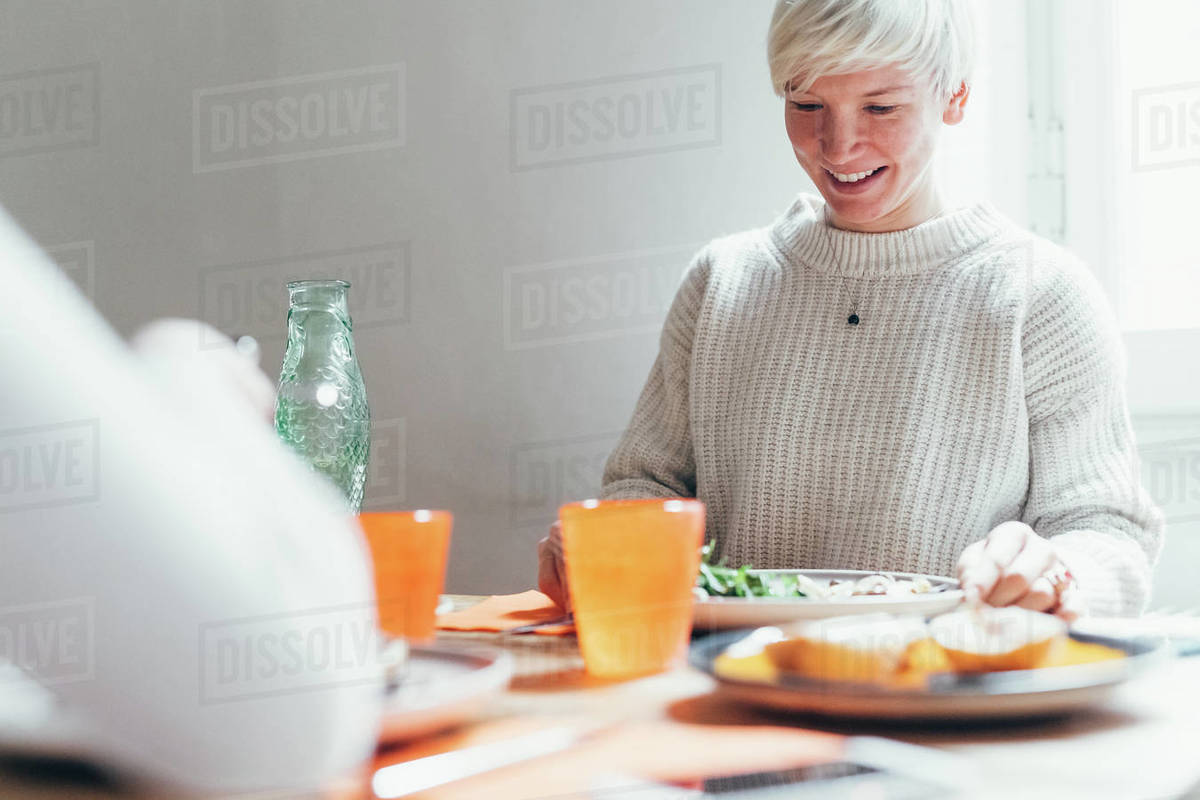 Girlfriends having lunch at home - Royalty-free Stock Photo | Dissolve