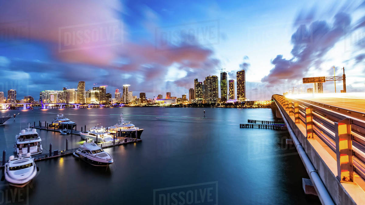 Boats moored at dock, cityscape in background, Miami, Florida, USA ...