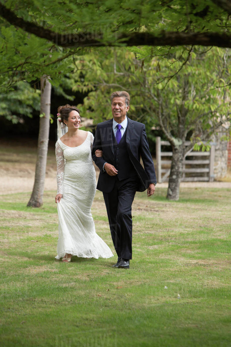 Father walking daughter to wedding - Royalty-free Stock Photo | Dissolve