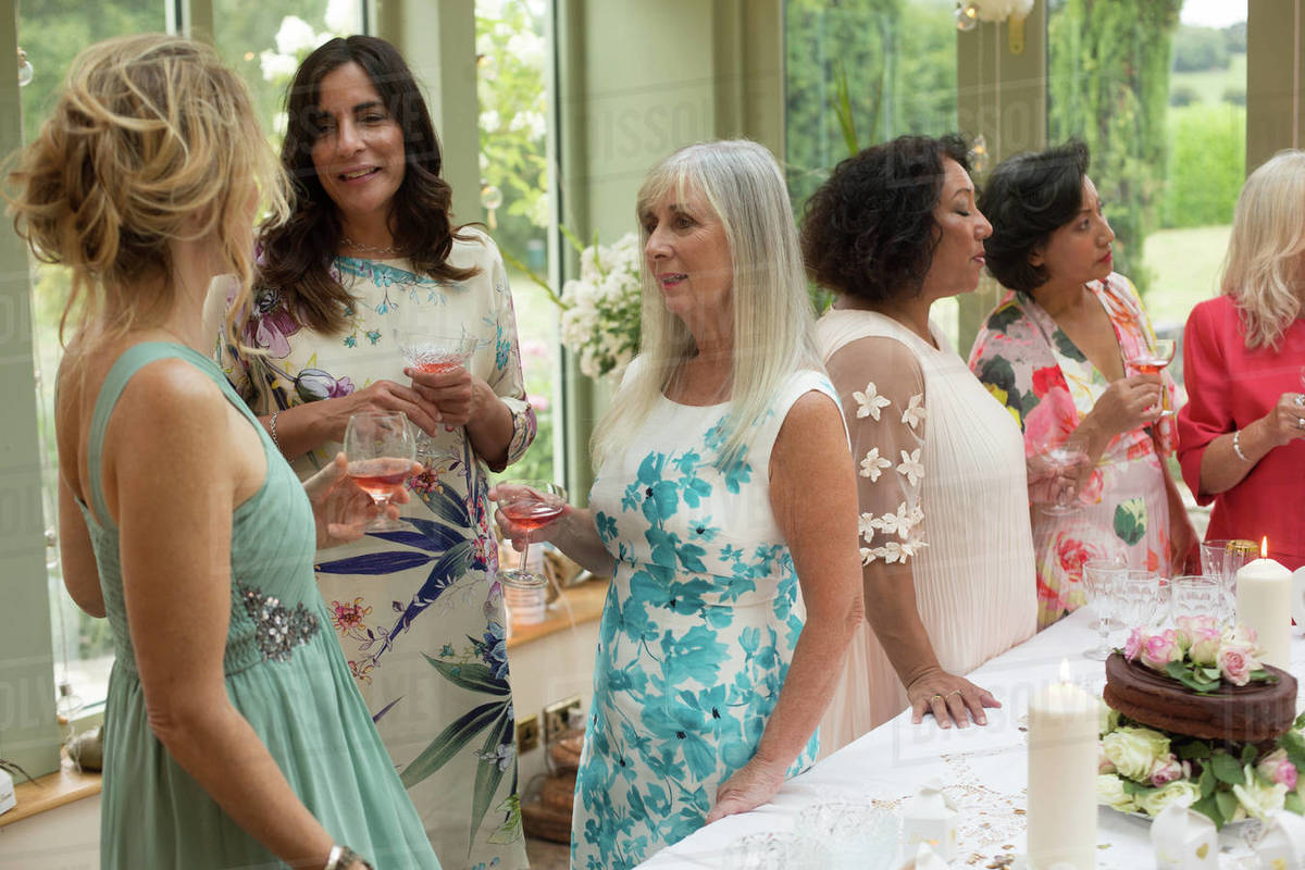 Female wedding guests at reception - Royalty-free Stock Photo | Dissolve