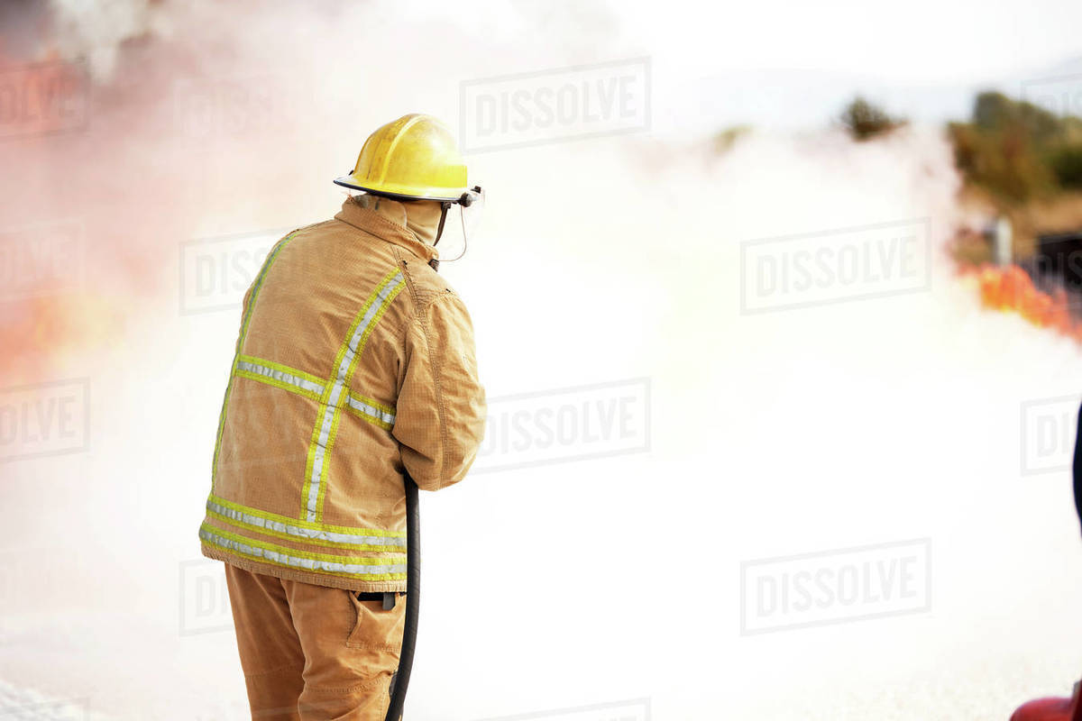 Firemen training, fireman spraying firefighting foam at training ...