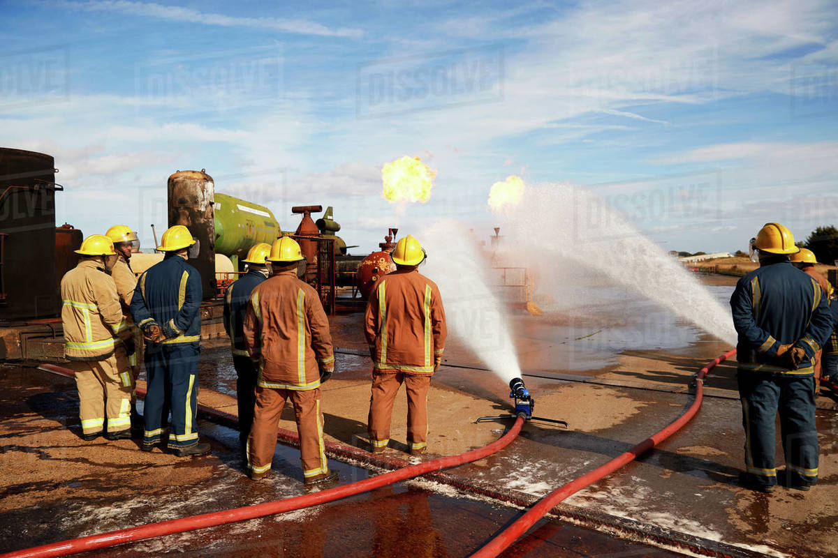 Firemen training to put out fire on burning tanks, Darlington, UK ...
