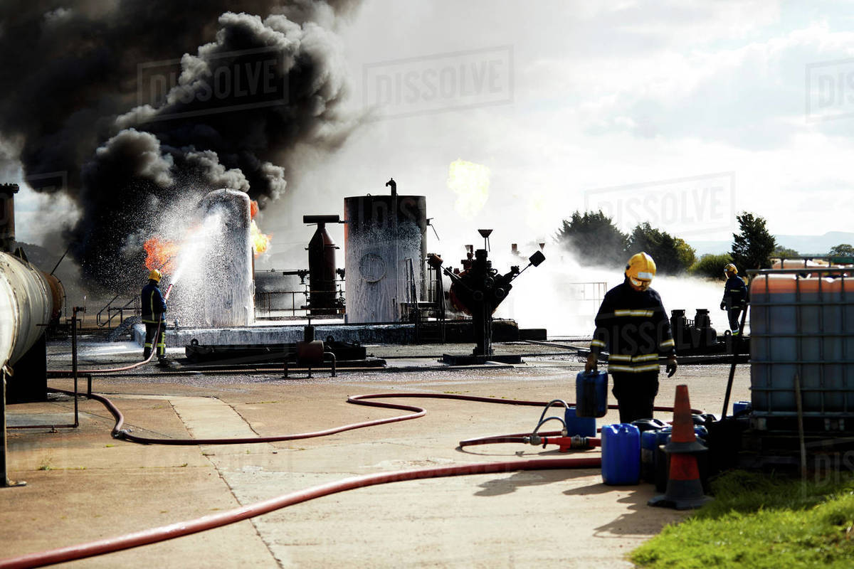 Firemen training to put out fire on burning tanks, Darlington, UK ...