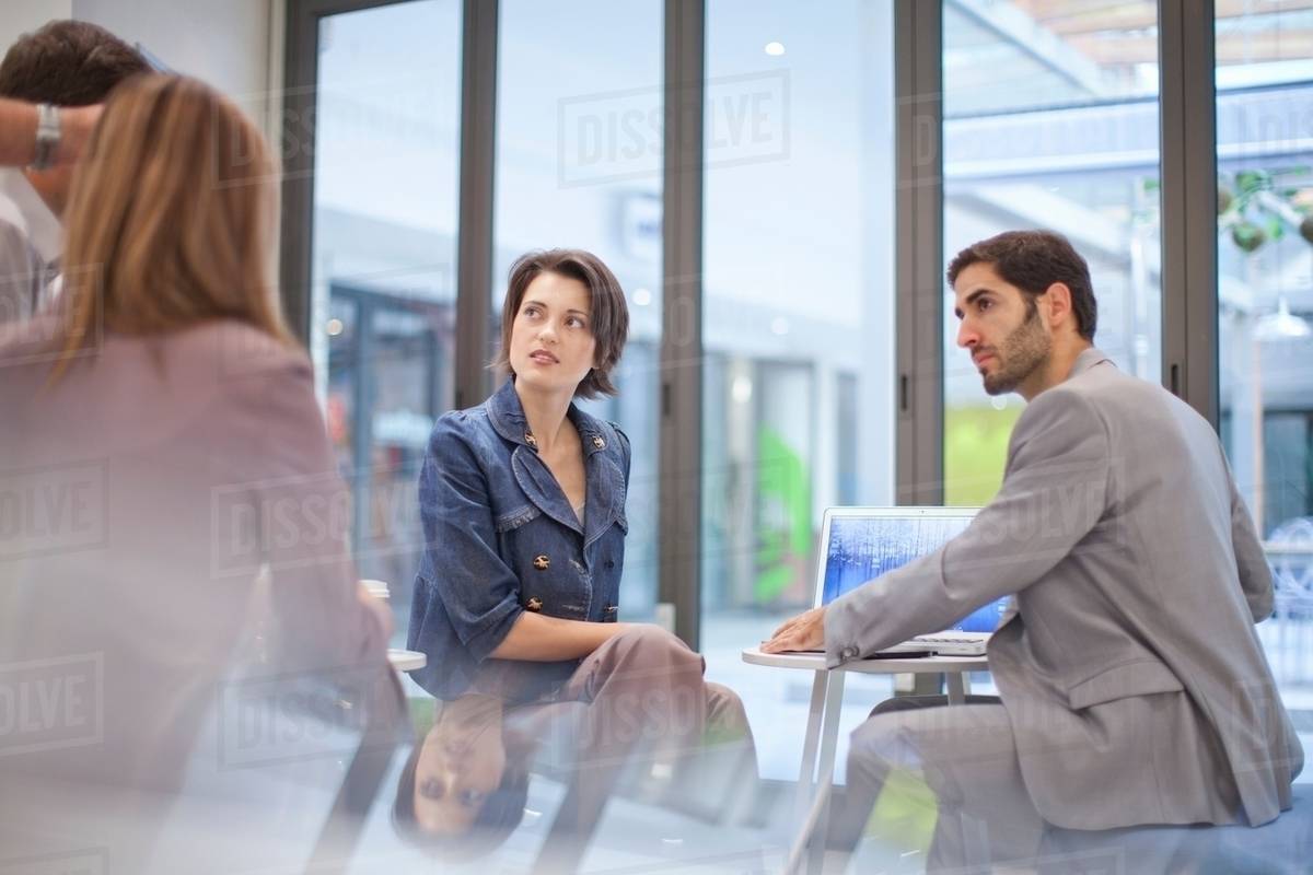 Office colleagues having discussion - Stock Photo - Dissolve