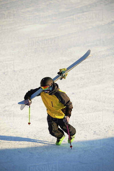 Skier walking up mountain, Saas-Fee, Valais, Switzerland - Royalty-free ...