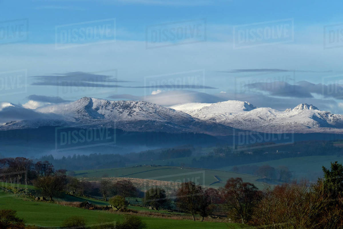 Scenic landscape with distant snow capped mountains, Llanberis, Gwynedd ...