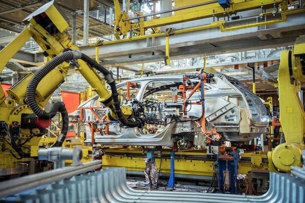 Robots with car body on production line in car factory - Stock Photo ...