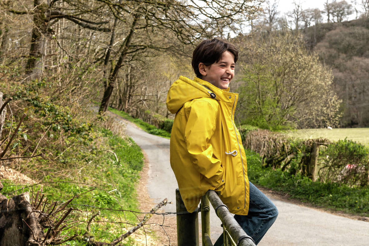Boy playing in countryside - Royalty-free Stock Photo | Dissolve