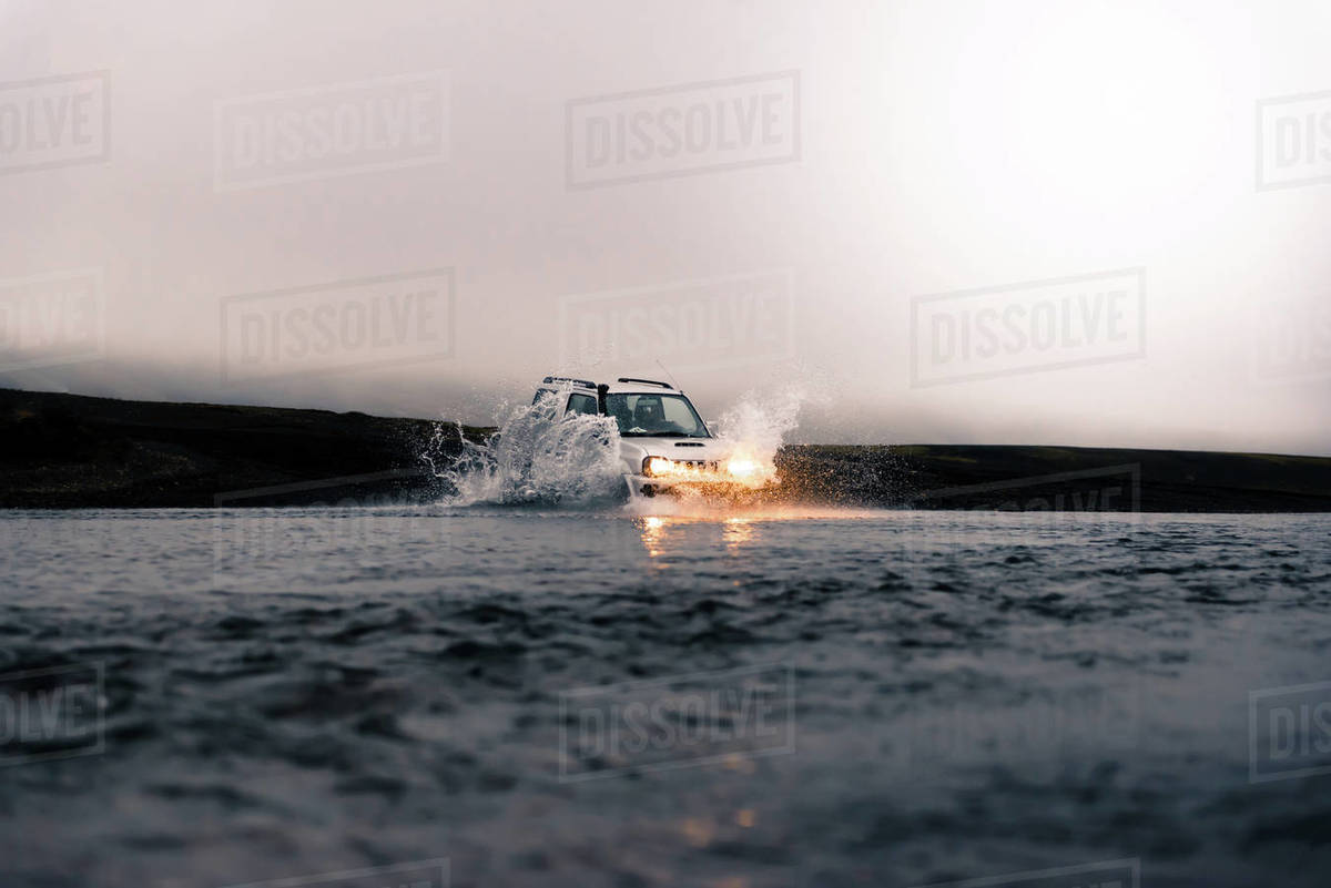 Off road vehicle driving in river, Landmannalaugar, Iceland - Stock ...