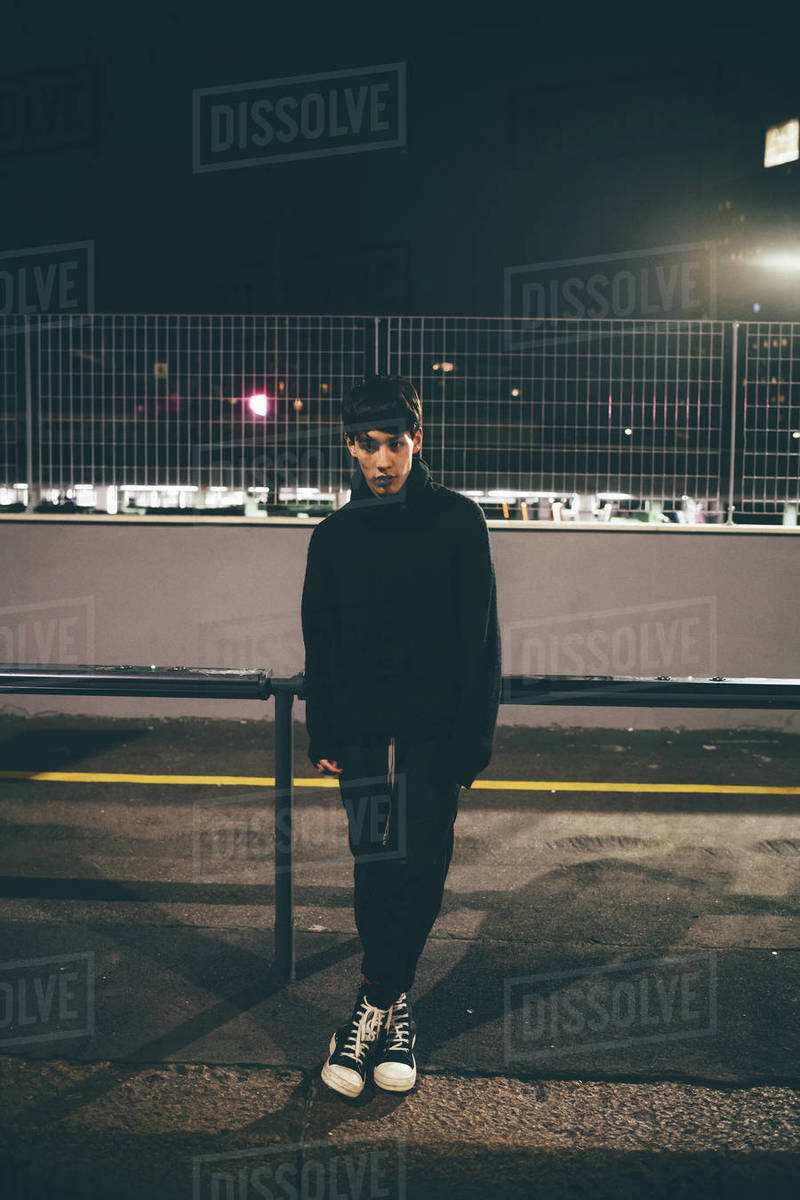 Man leaning against railing waiting, Milan, Italy - Royalty-free Stock ...