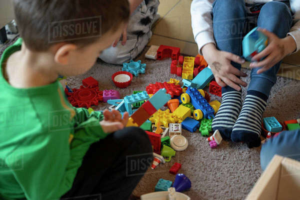 Childhood creativity kids playing together with colorful building ...