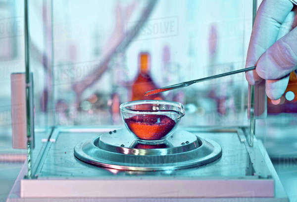 Scientist conducting a chemical experiment in a laboratory - Royalty ...