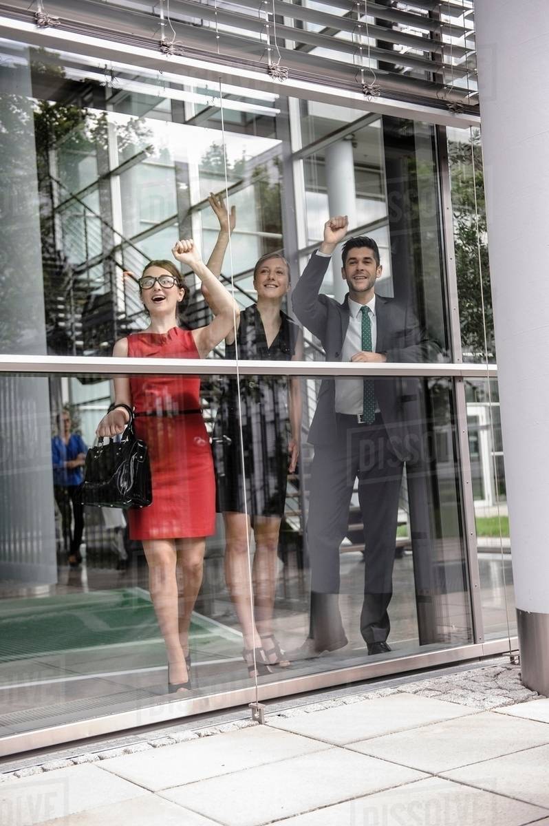 Business people knocking on window - Stock Photo - Dissolve