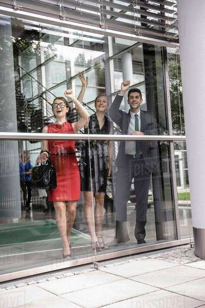 Business people knocking on window - Stock Photo - Dissolve
