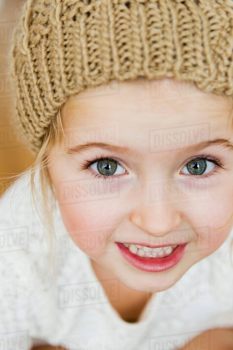 Close up of girls smiling face - Stock Photo - Dissolve