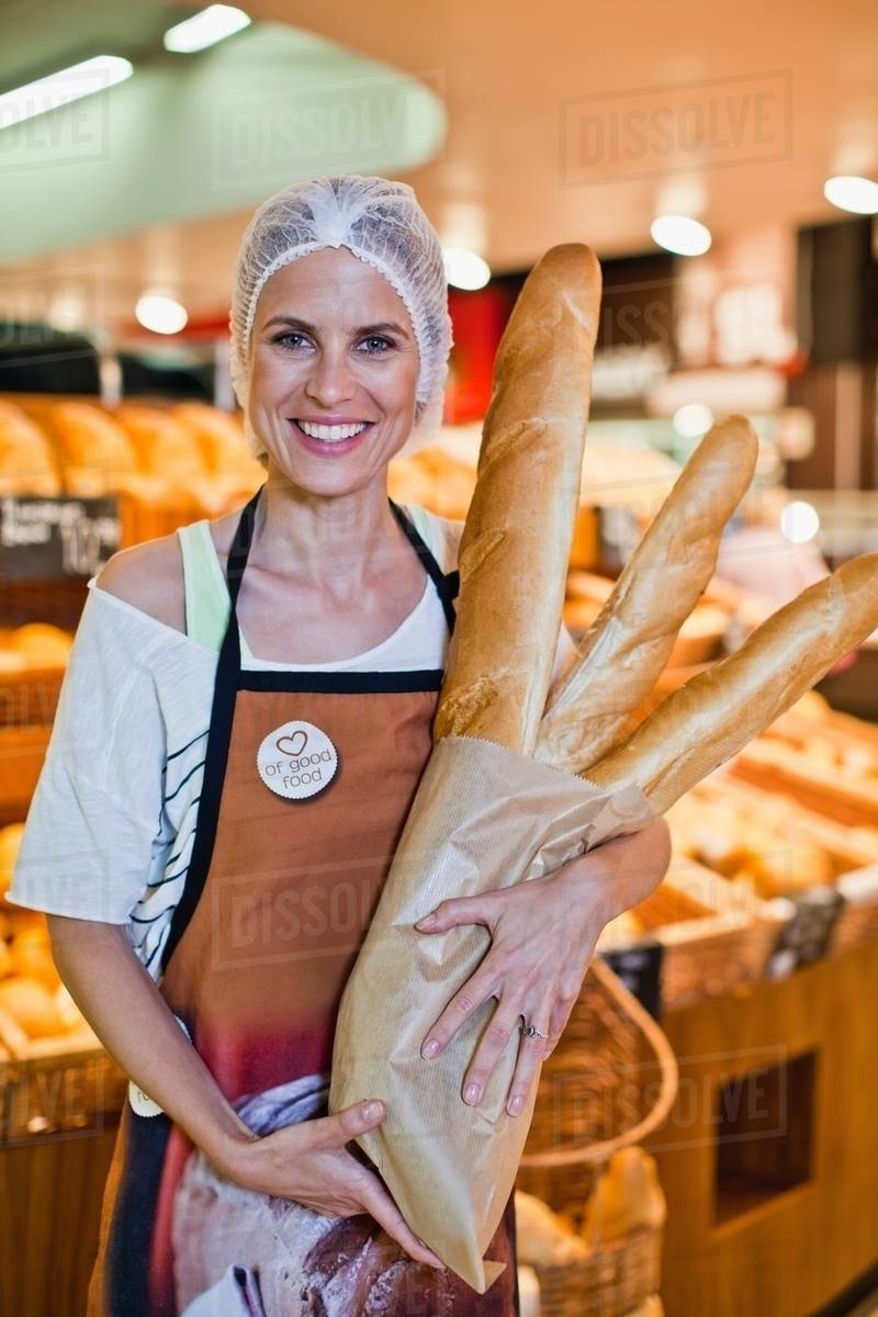 Baker smiling in store - Royalty-free Stock Photo | Dissolve