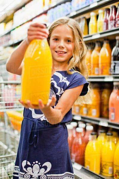 Girl shopping in grocery store - Stock Photo - Dissolve