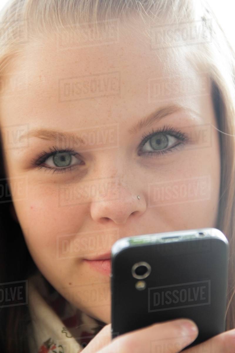 Teenage girl using cell phone outdoors - Royalty-free Stock Photo ...