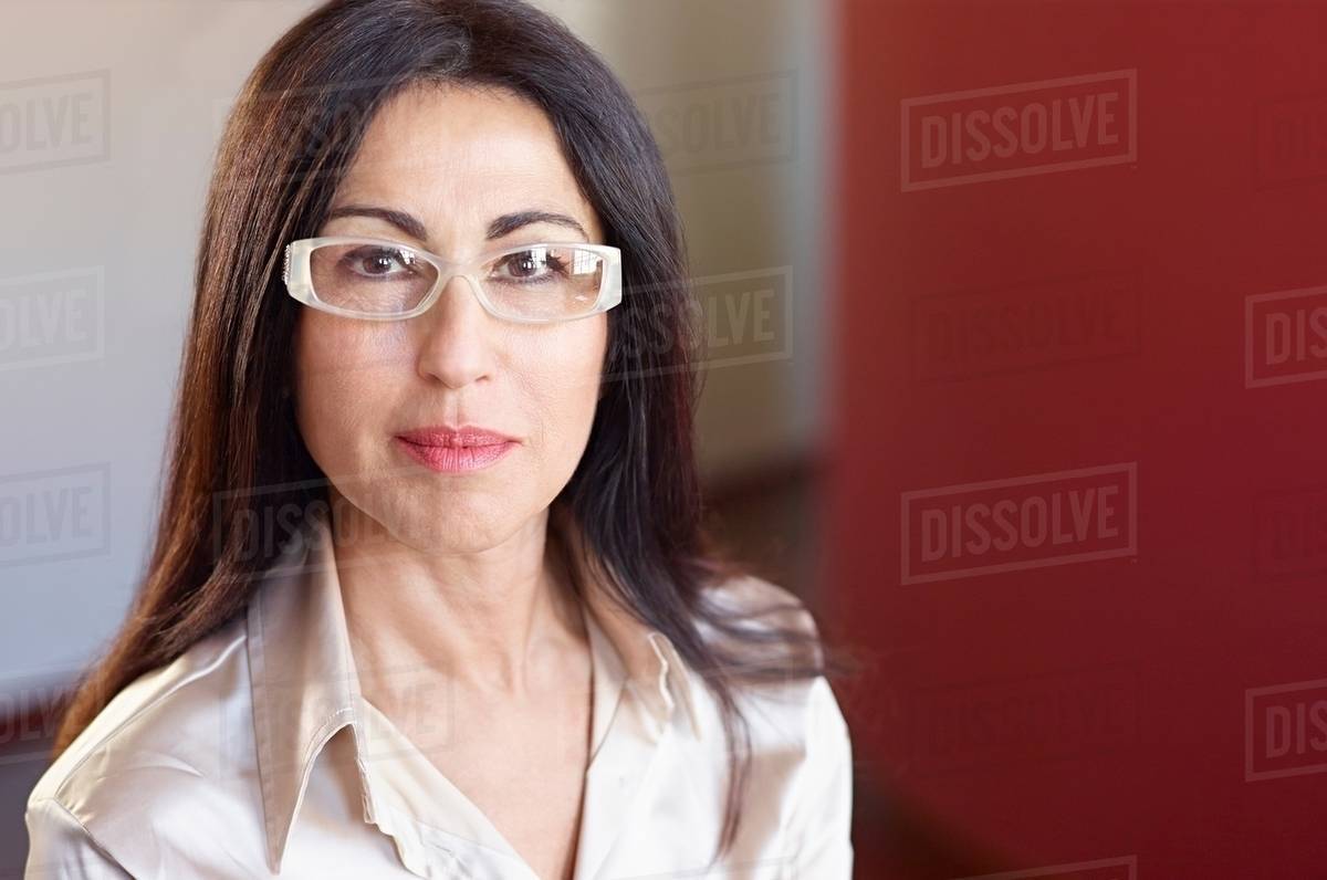 Portrait of businesswoman wearing glasses - Stock Photo - Dissolve