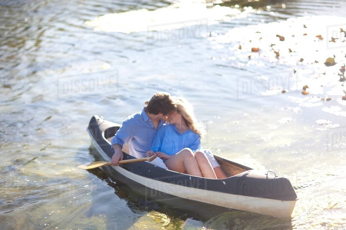 Young romantic couple in rowing boat on river - Royalty-free Stock ...
