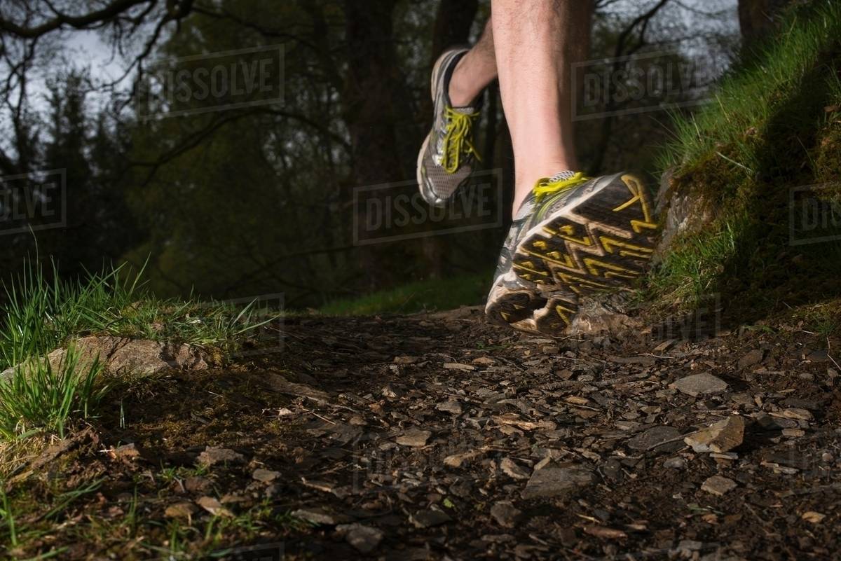 Man wearing trainers running, close up - Royalty-free Stock Photo ...
