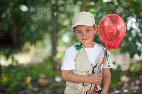 Boy with red fishing net - Royalty-free Stock Photo | Dissolve